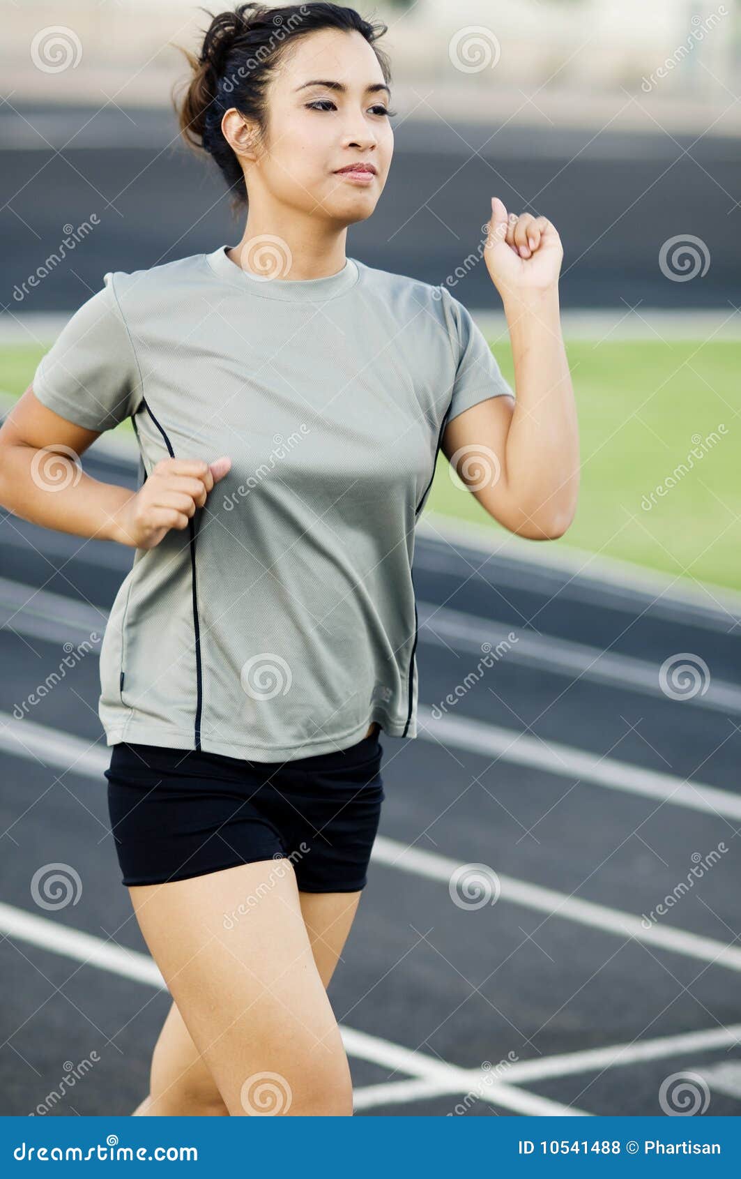 Woman running on track stock photo. Image of outside - 10541488