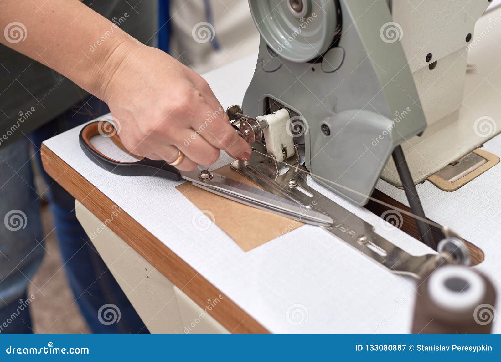 A Woman Runs a Thread in the Sewing Machine Stock Image - Image of ...