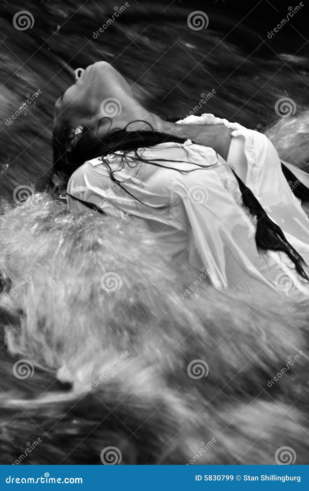 Woman in rushing water stock image. Image of flow, aquatic - 5830799