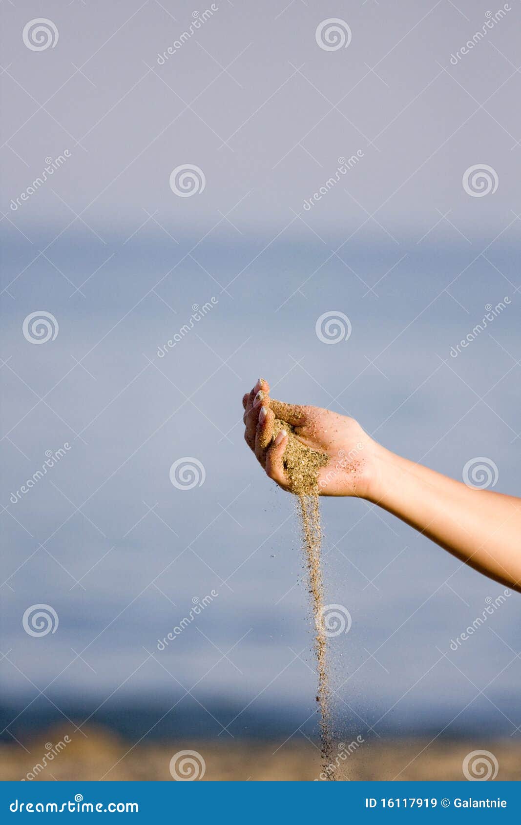 Woman s hand dropping sand stock image. Image of summer - 16117919