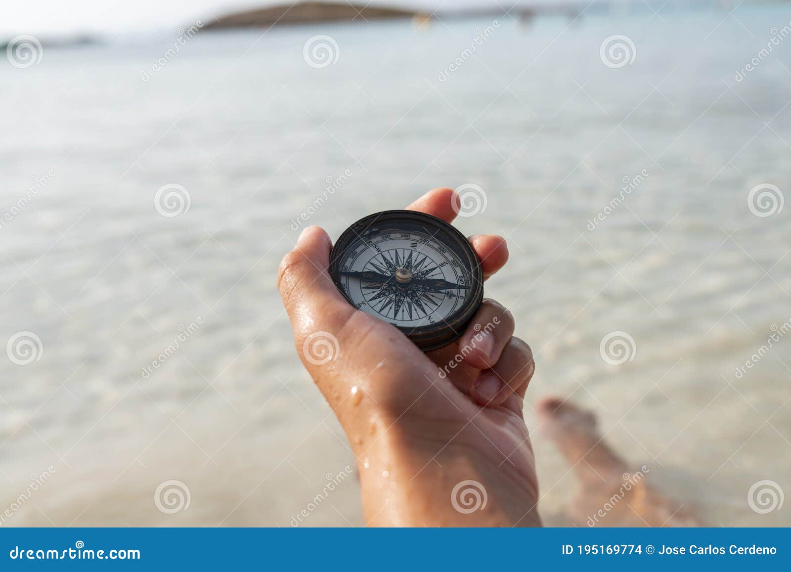 Man Holds A Compass In His Hand. Man Wathing Compass Holding In His ...