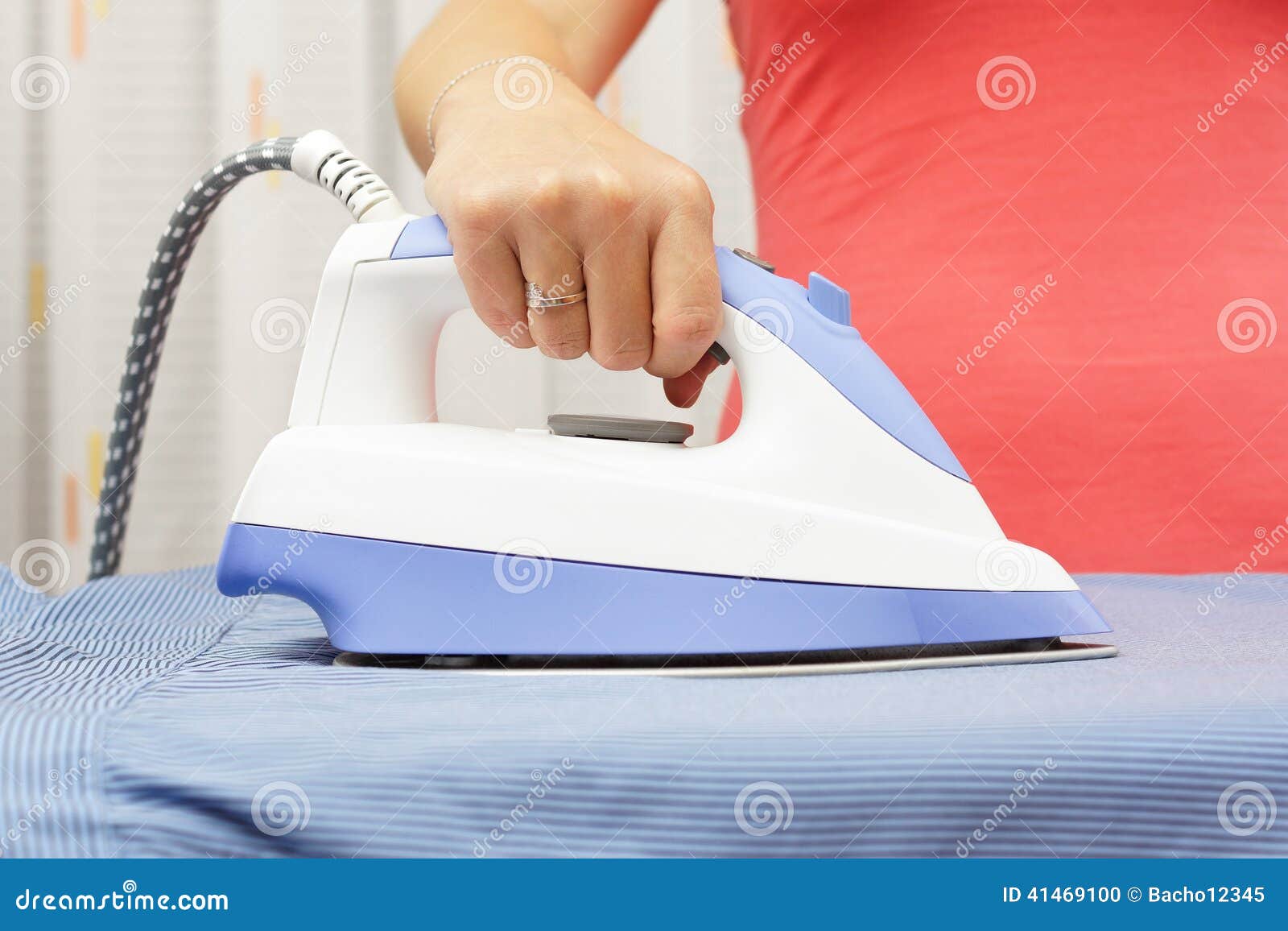 Woman S Hand Ironing Shirt on Ironing Board Stock Photo - Image of ...