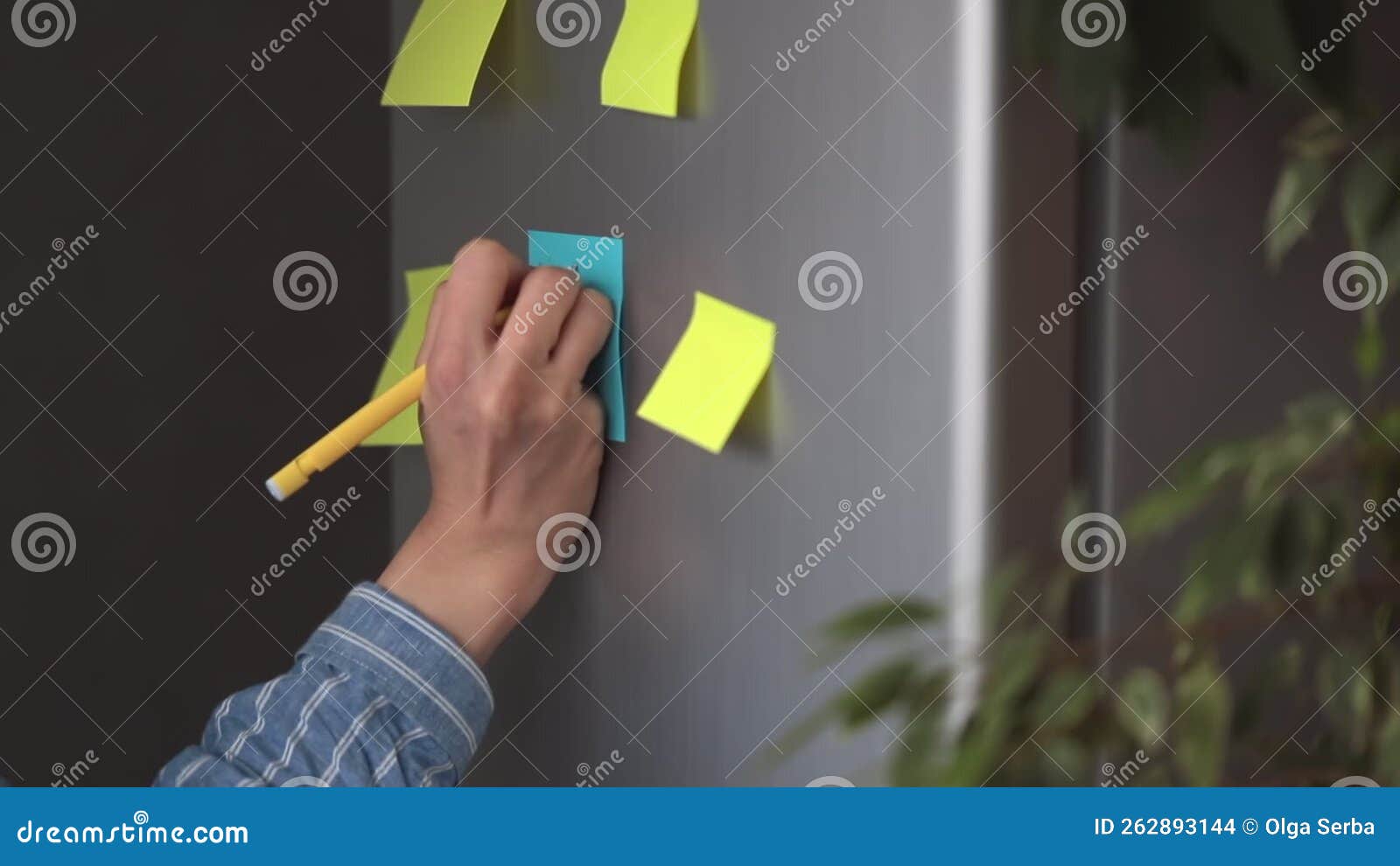 Woman S Hand Makes a Note on a Sticker on the Refrigerator. Planning ...