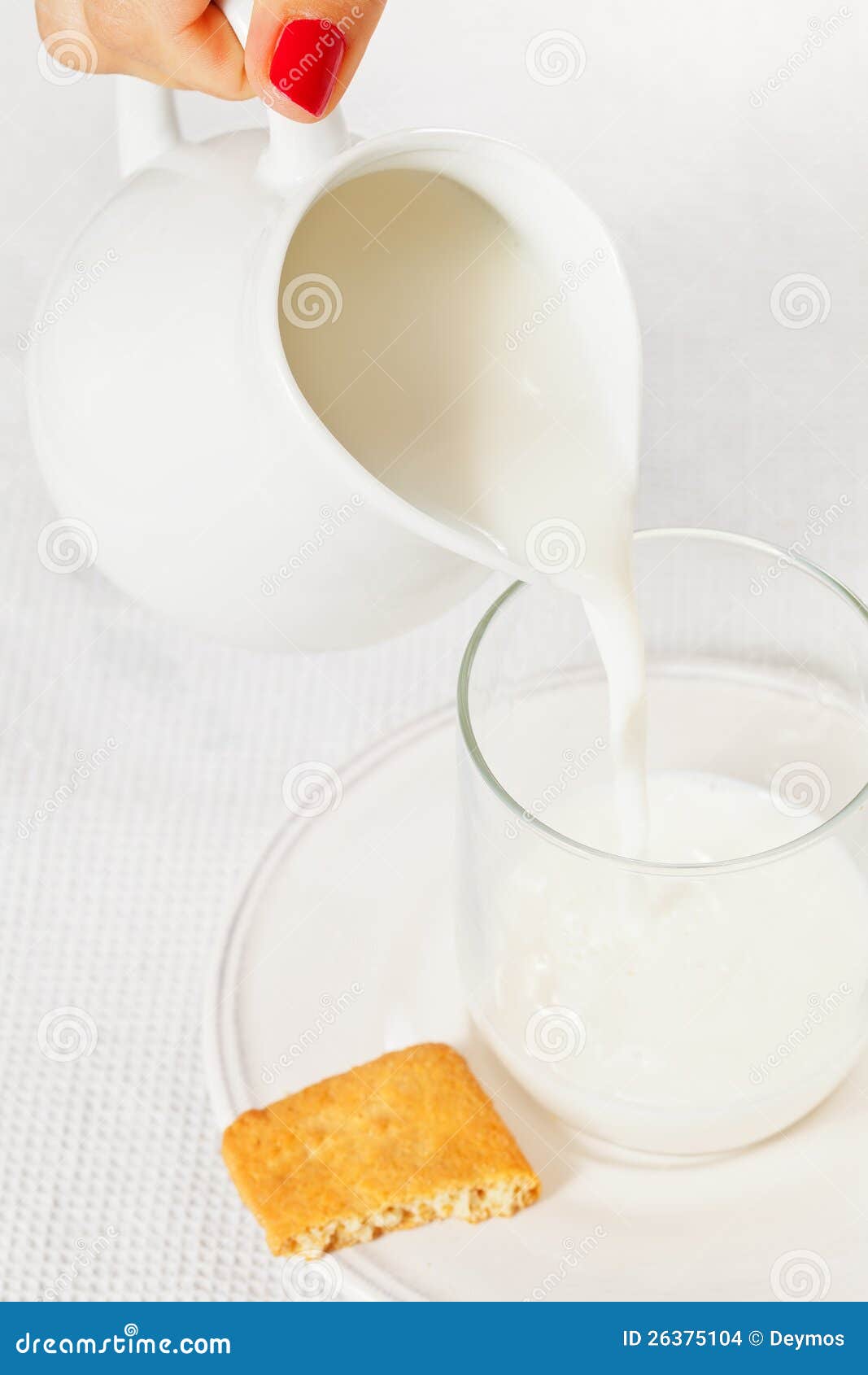 Woman s hand pouring milk stock photo. Image of health - 26375104