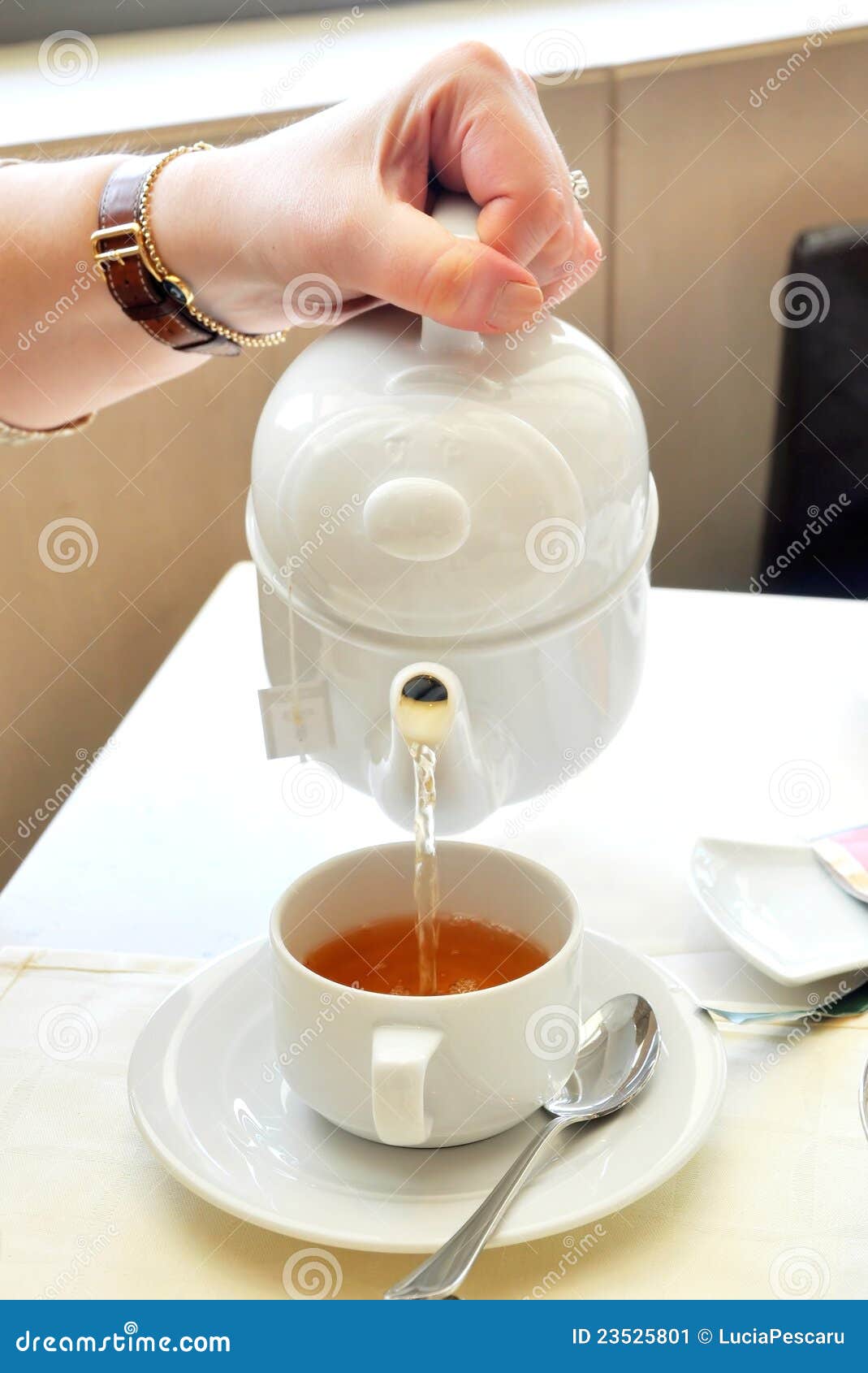 Woman s hand pouring tea stock image. Image of culture - 23525801