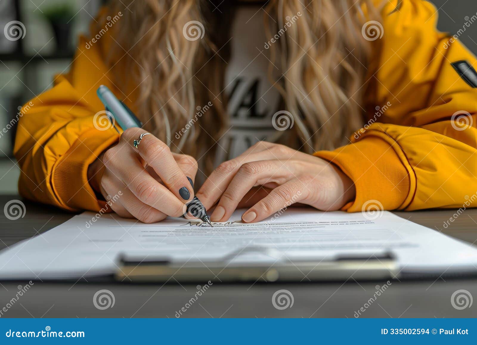 Woman S Hand Signing a Document, Representing Agreement, Commitment ...