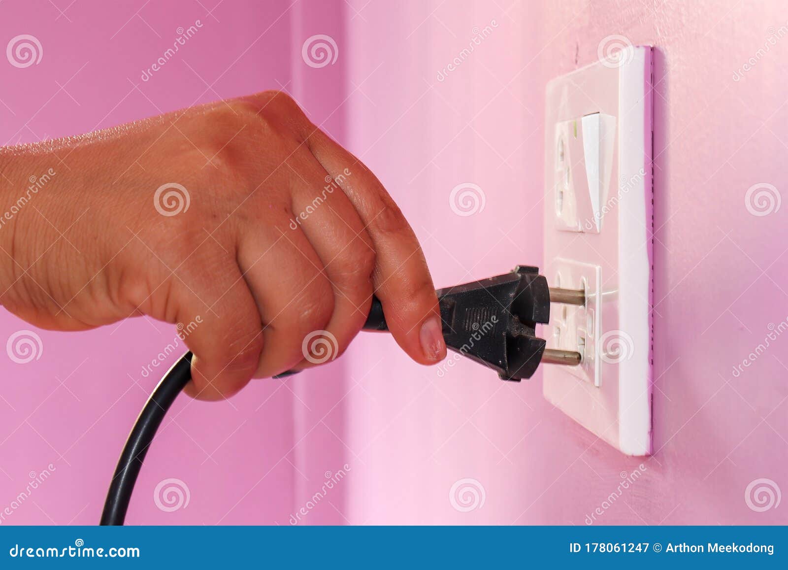 The Woman`s Hand, Unplug or Pull the Electric Plug. Stock Image - Image ...