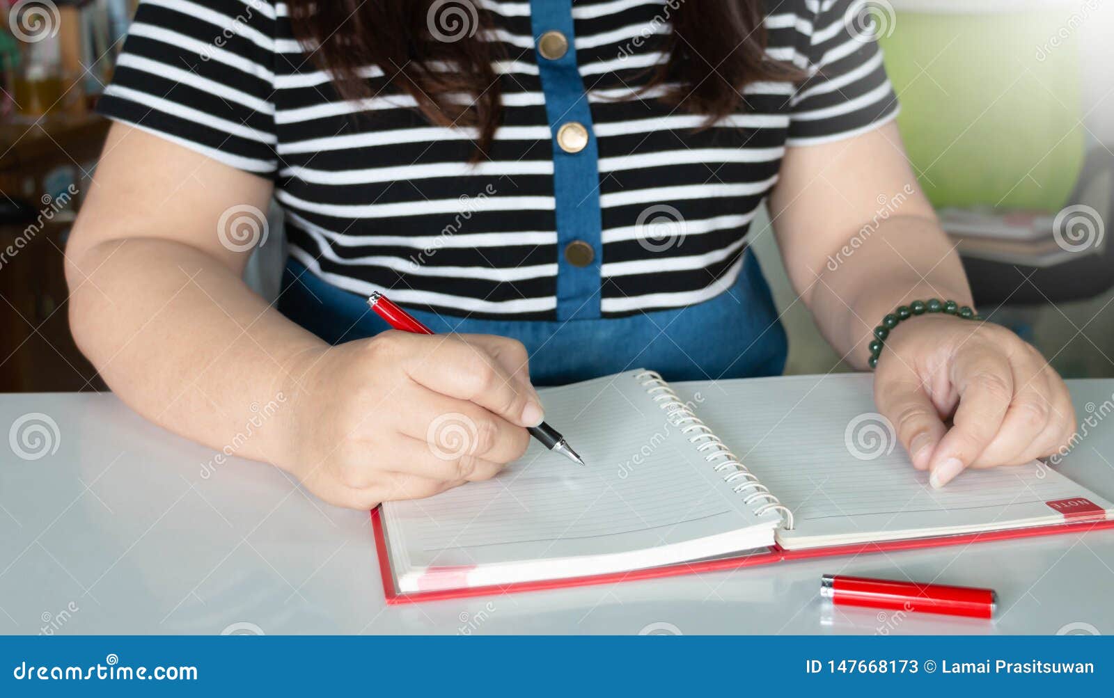 Woman`s hand writing stock image. Image of spelling - 147668173