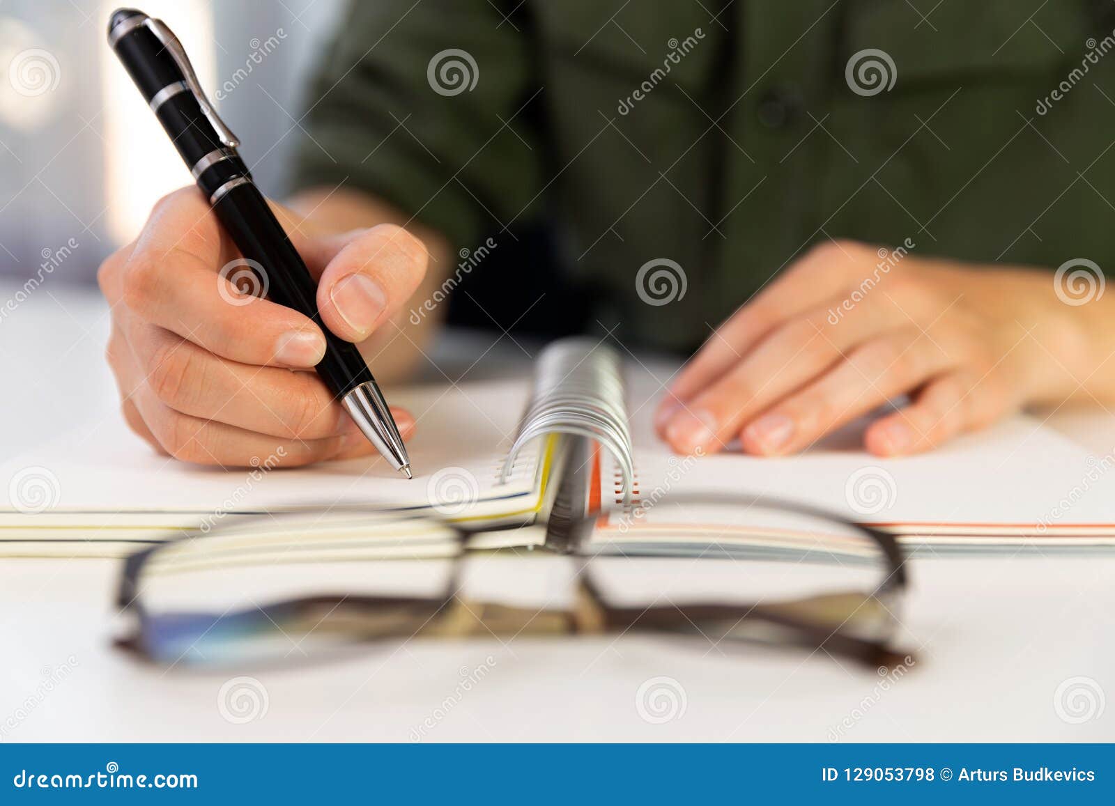 Woman`s Hands with Pen Writing on Notebook. Modern Office Desk Stock ...