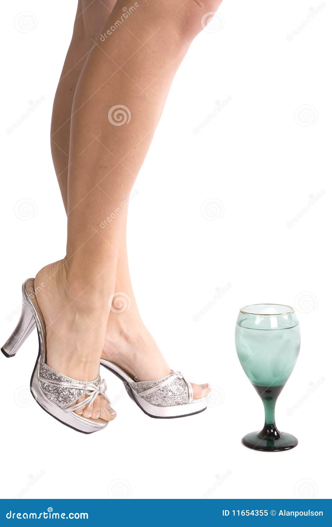 Woman s legs with glass stock image. Image of female - 11654355