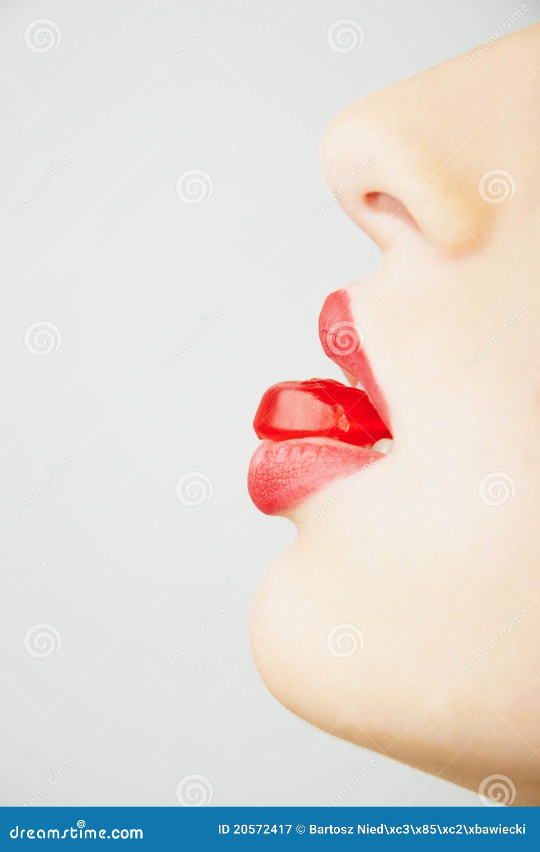 Woman S Lips Biting a Red Jelly Stock Image - Image of hand, adult ...