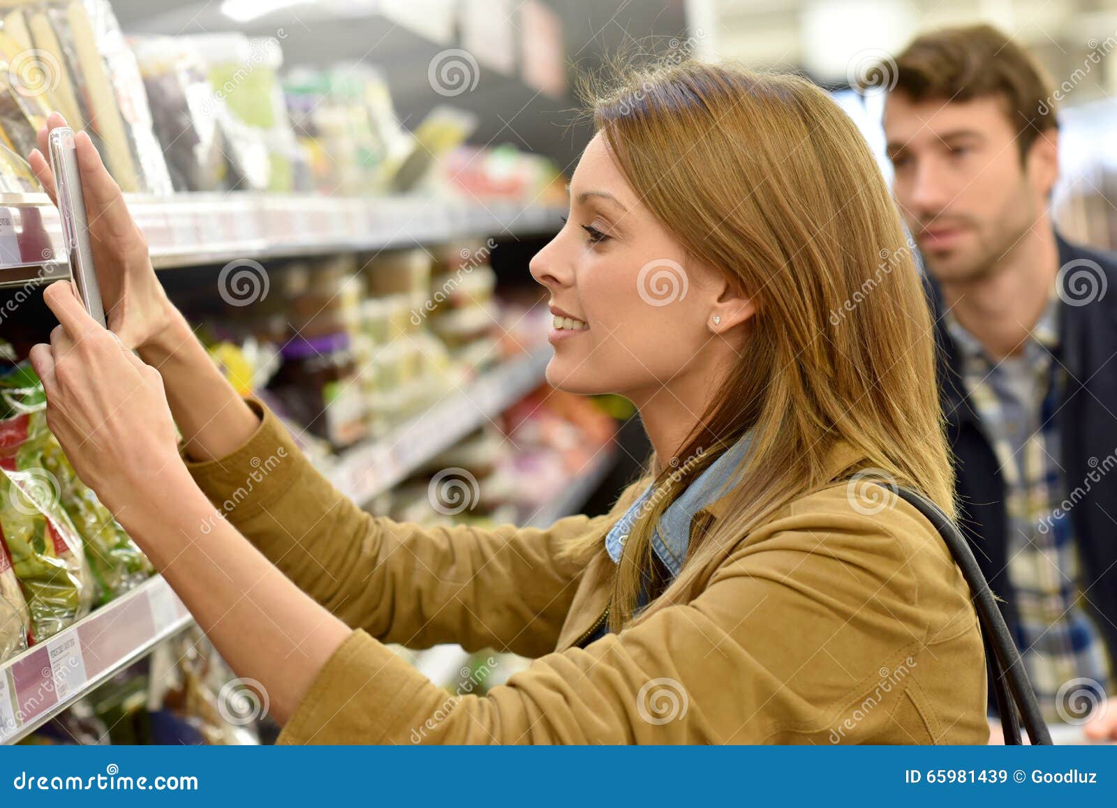 Woman Scanning Barcodes with Smartphone Stock Image - Image of barcodes ...