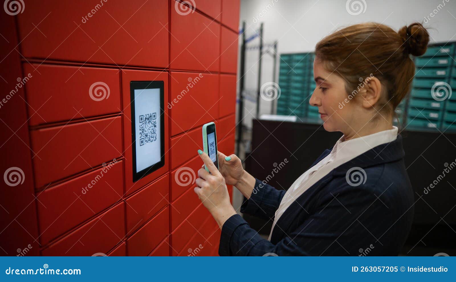 A Woman Scans a Red Code To Pick Up a Parcel at a Parcel Machine ...