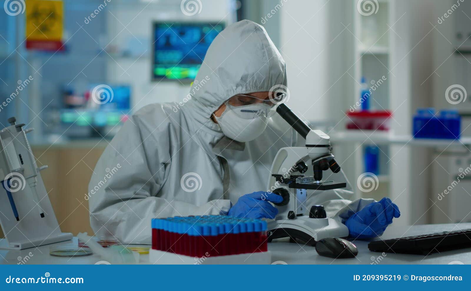 Woman Scientist in Ppe Suit Working in Lab Using Modern Microscope ...