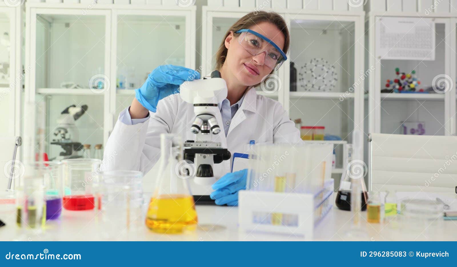 Scientist Does Study of Sample Looking through Microscope Stock Video ...