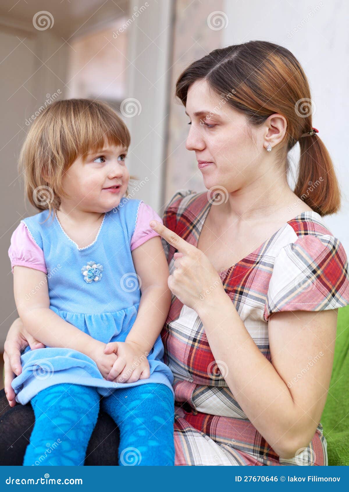 Woman scolds child in home stock photo. Image of objurgate - 27670646