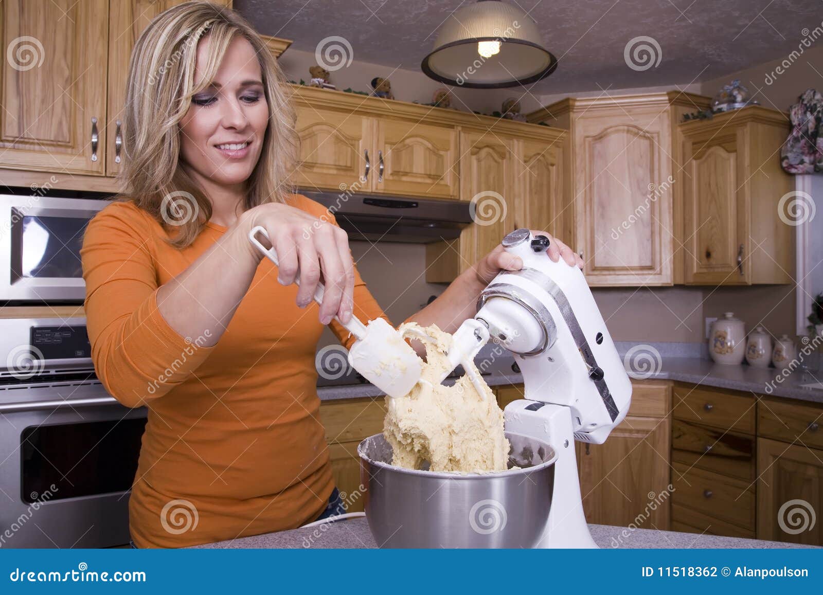 Woman Scraping Dough in Mixer Stock Photo - Image of cook, kitchen ...