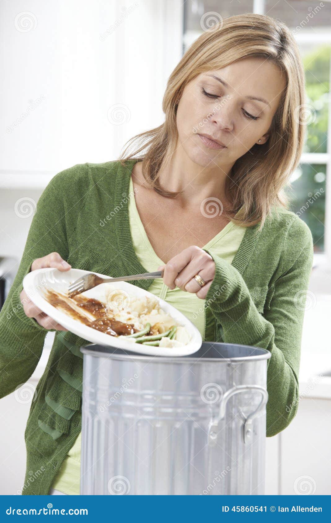Woman Scraping Food Leftovers into Garbage Bin Stock Image - Image of ...