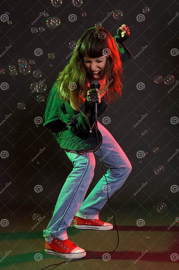 Woman screaming in mike stock image. Image of karaoke - 5572029