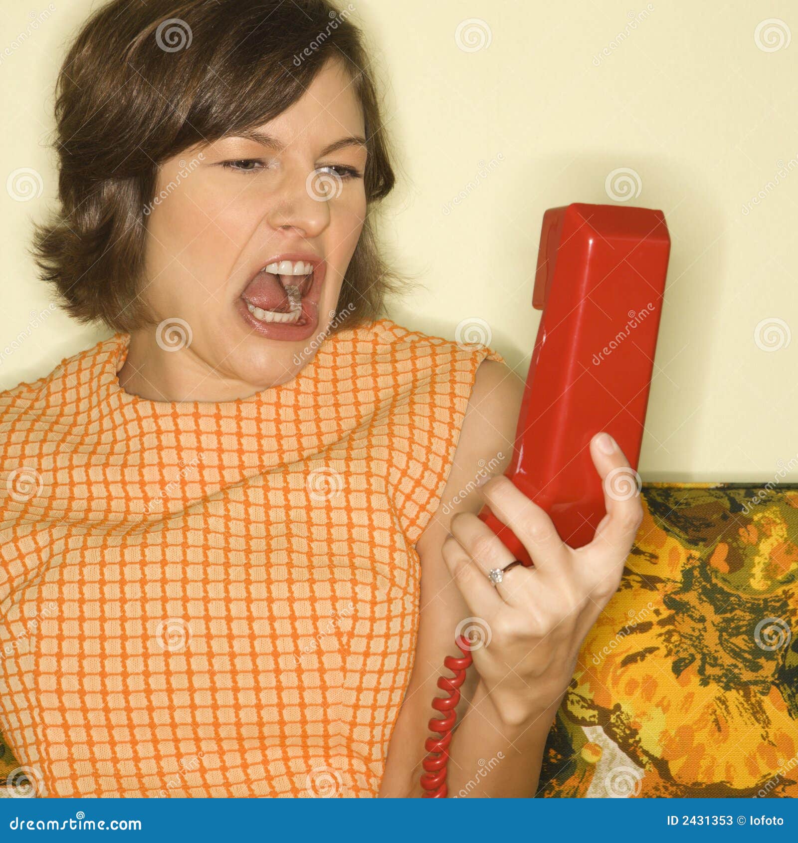 Woman screaming at phone. stock image. Image of colour - 2431353