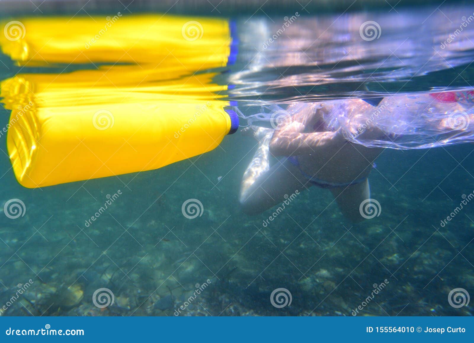 Woman in the Sea Surrounded by Plastic Garbage Stock Photo - Image of ...
