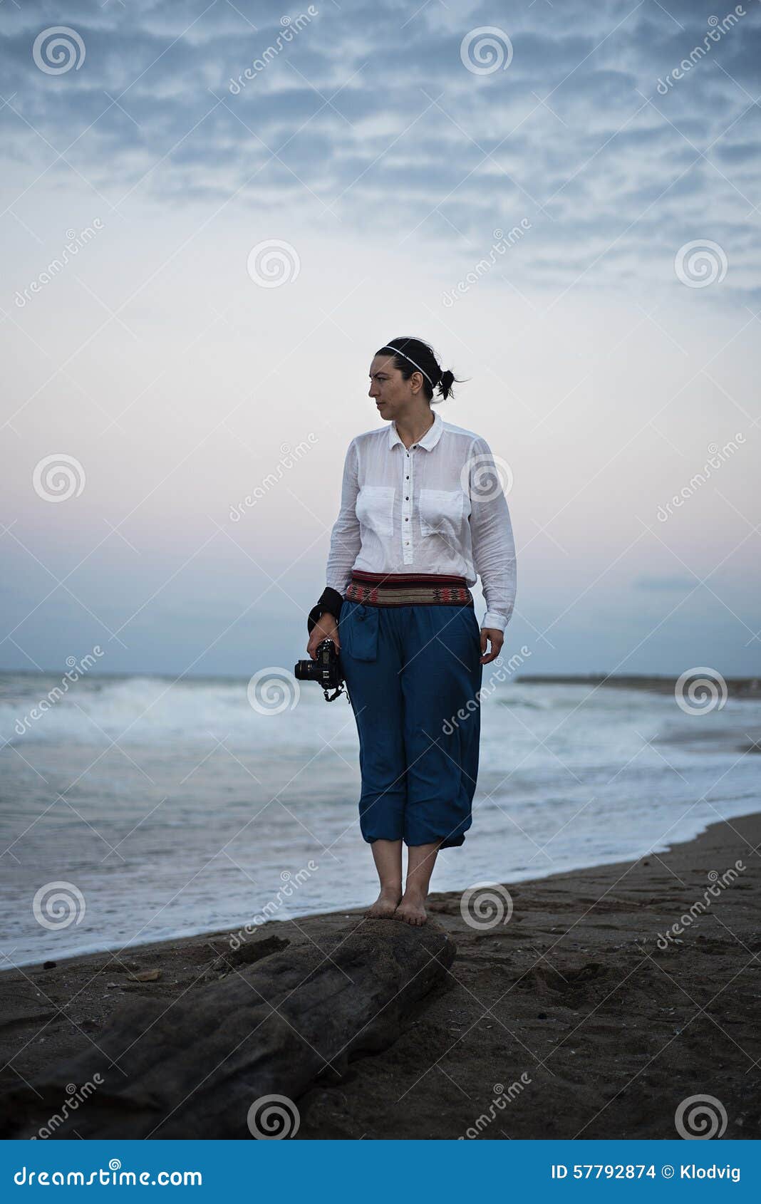 Woman on seaside stock photo. Image of evening, standing - 57792874