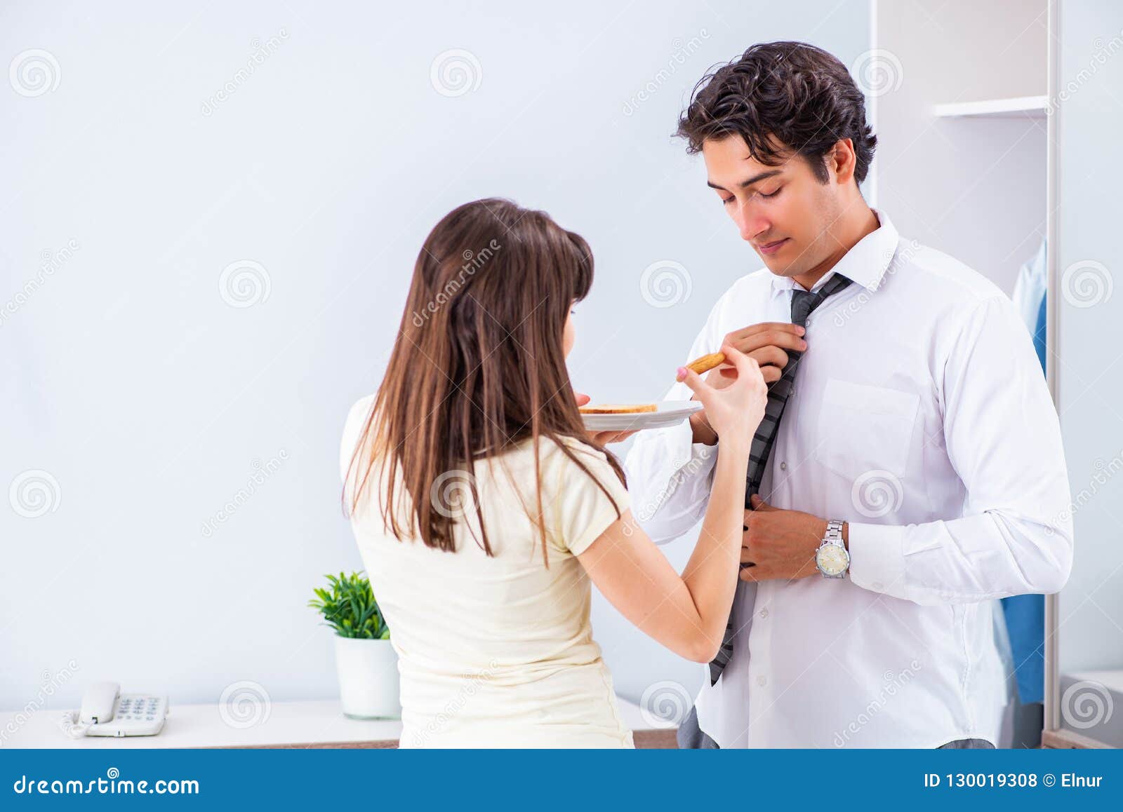 The Woman Sees Her Husband Off To Work Stock Photo - Image of buttoning ...