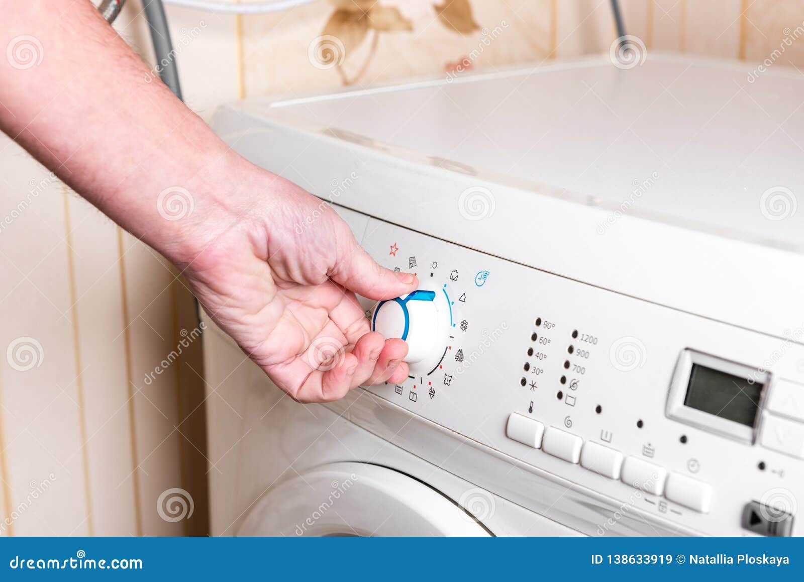 Woman Select the Program on Washing Machine. Laundry Day at Home. Stock ...