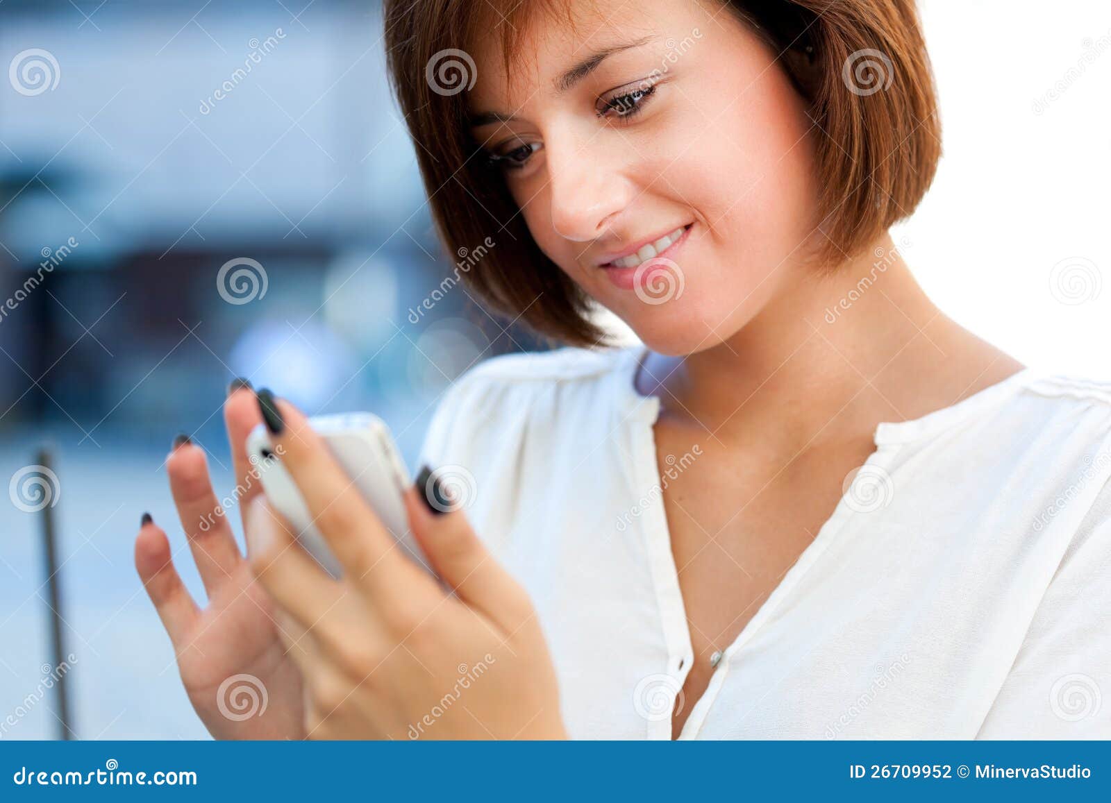 Woman sending sms stock photo. Image of technology, holding - 26709952