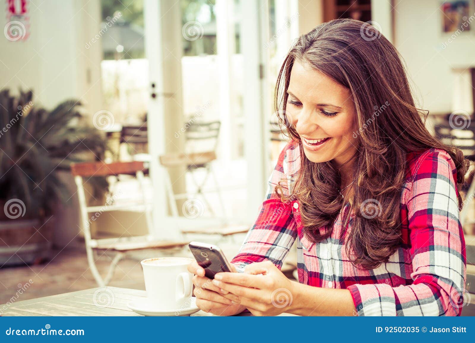 Woman Sending Text Message stock image. Image of drink - 92502035