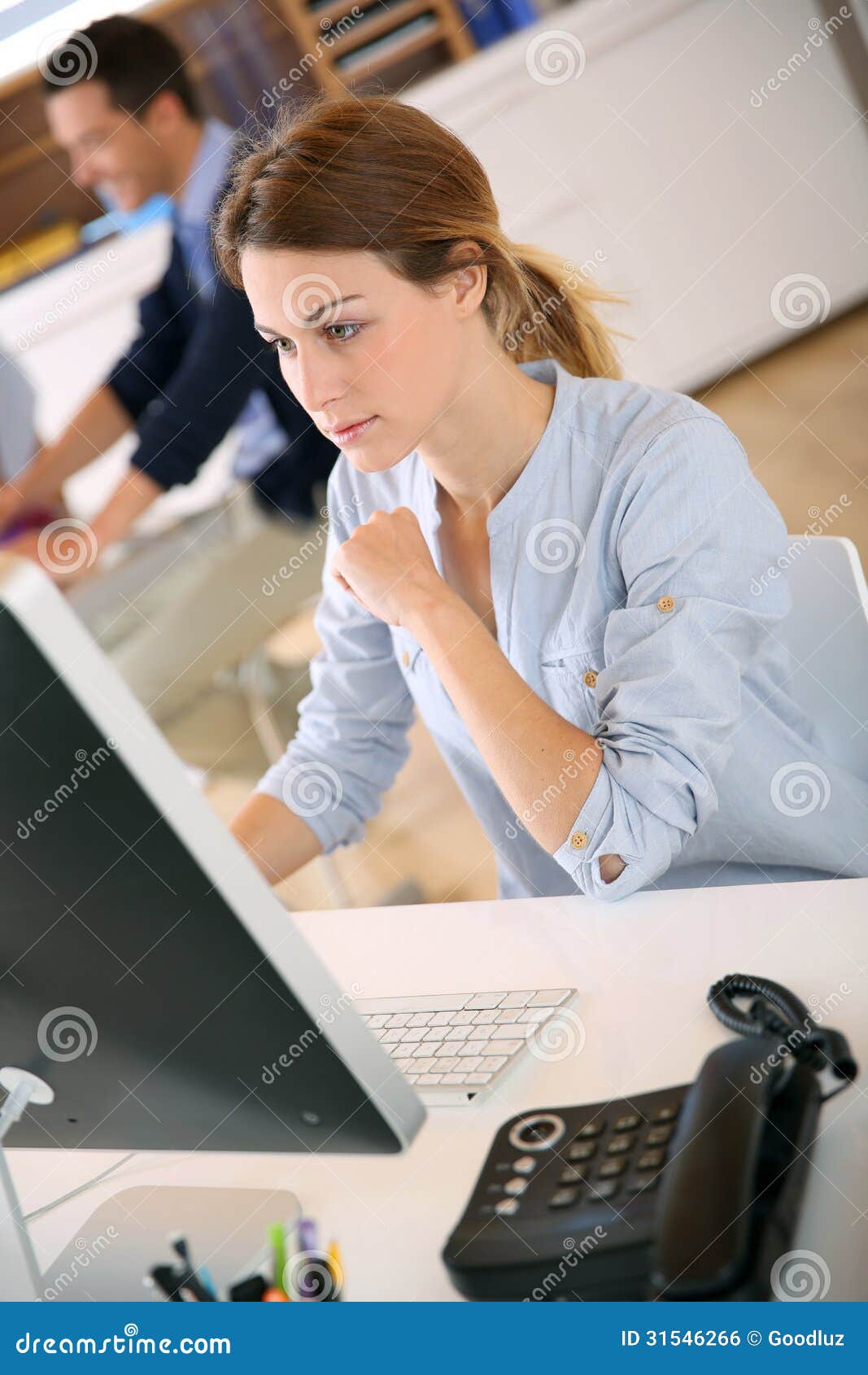 Woman with Serious Look Working on Computer Stock Photo - Image of ...