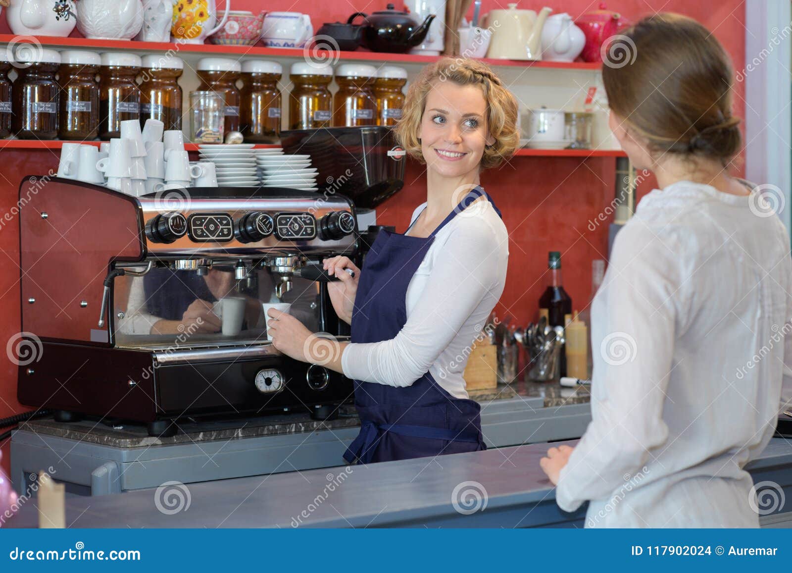 Woman Serving Coffee in Cafe Stock Photo - Image of female, turning ...