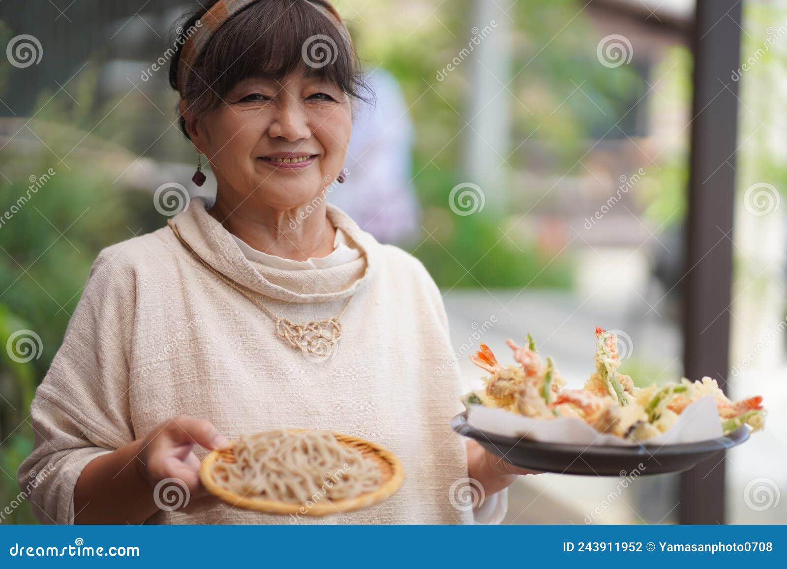 Woman serving a meal stock photo. Image of indoors, soba - 243911952