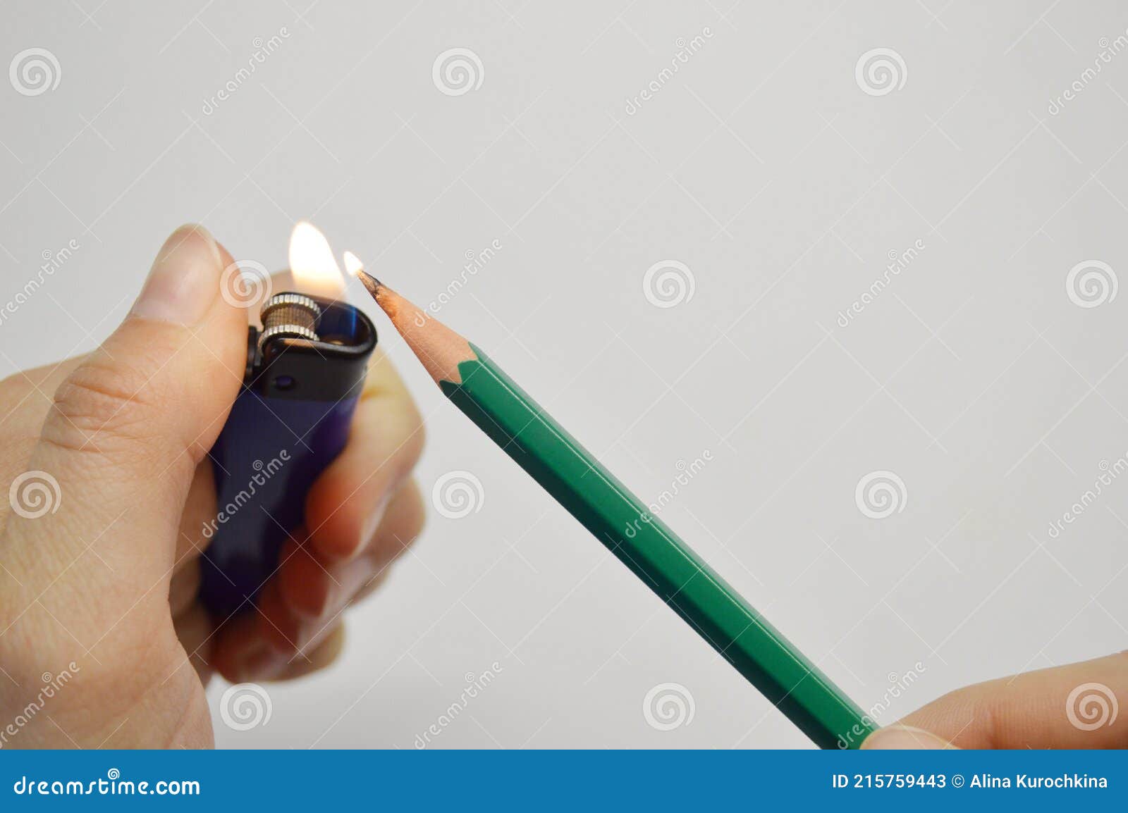 Woman Setting Fire To Pencil Lead with Lighter on White Background ...