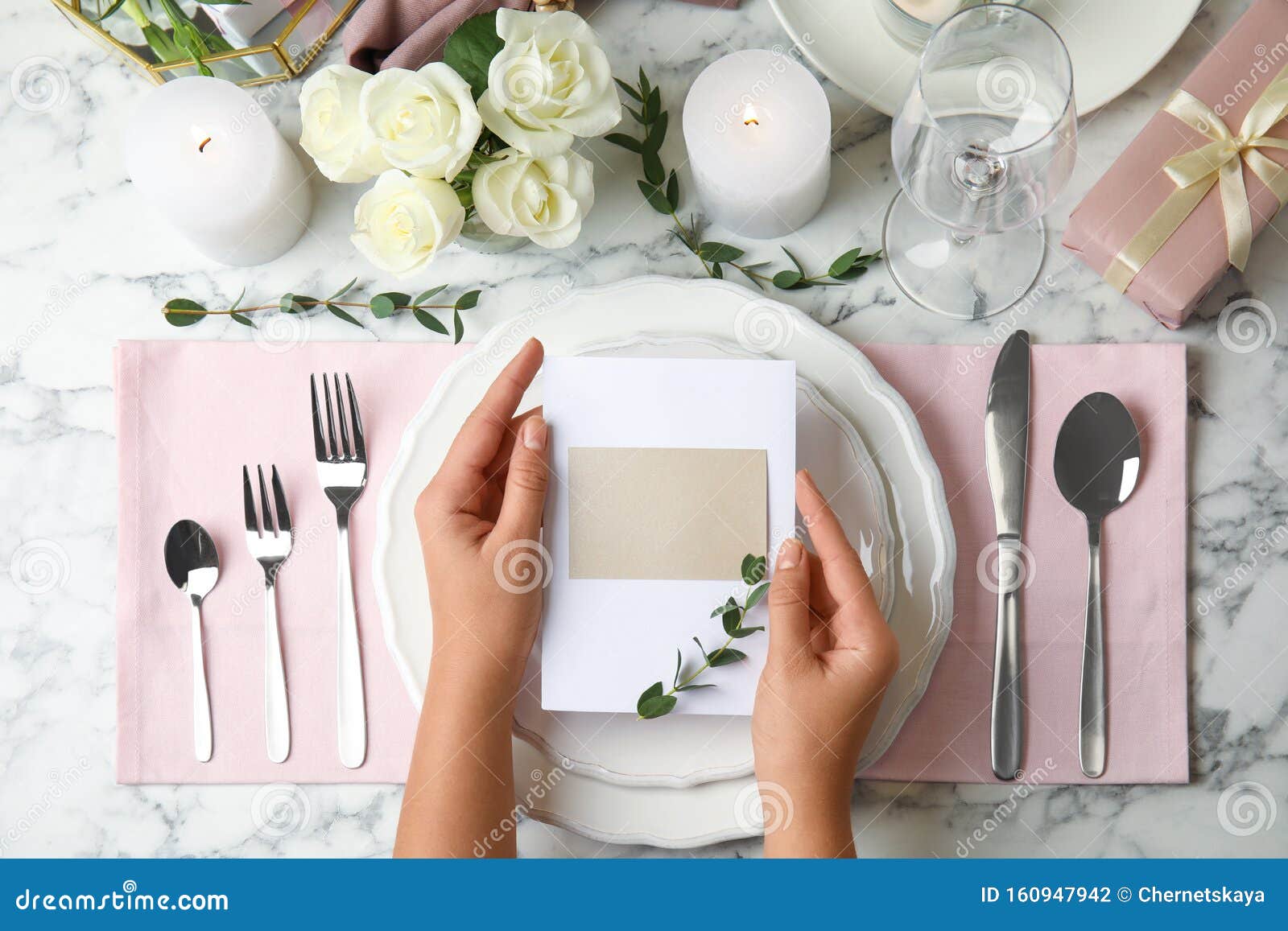 Woman Setting Table for Festive Dinner Stock Photo - Image of glass ...