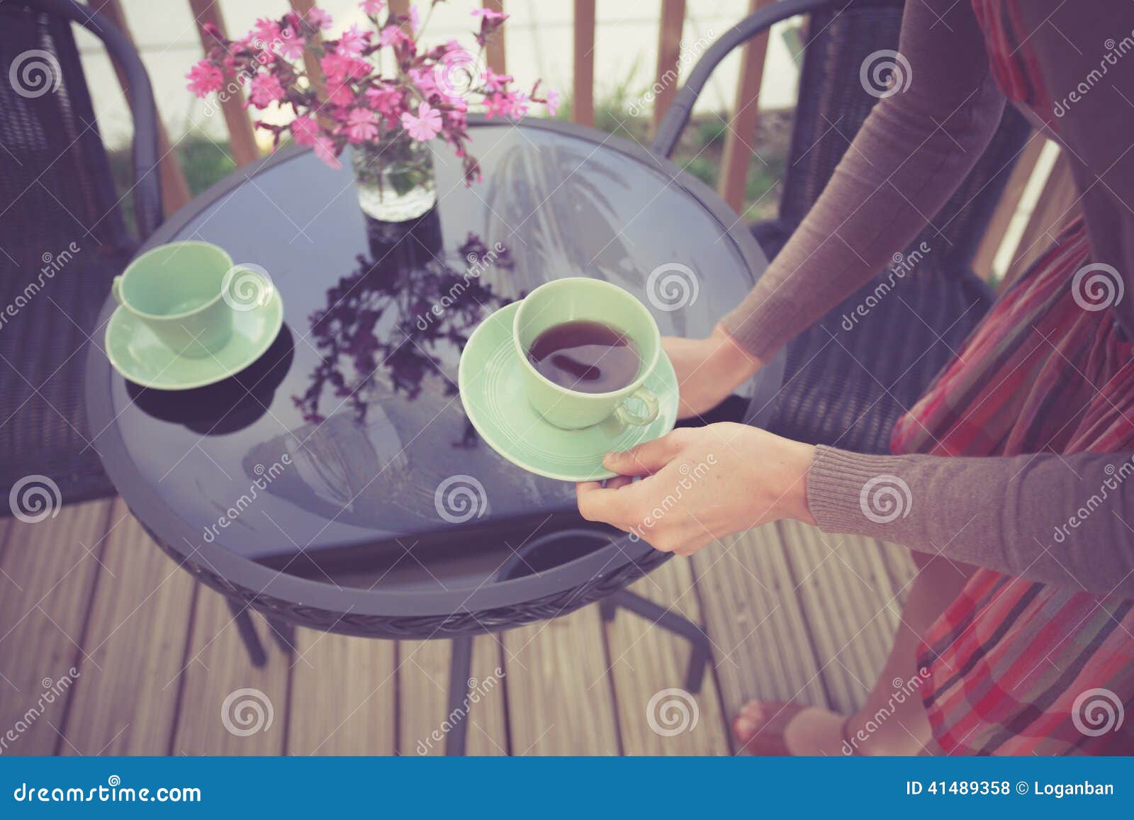 Woman Setting Table for Tea Outside Stock Photo - Image of person ...