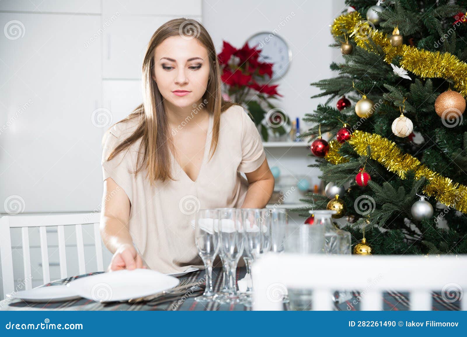 Woman setting up table stock photo. Image of lifestyles - 282261490