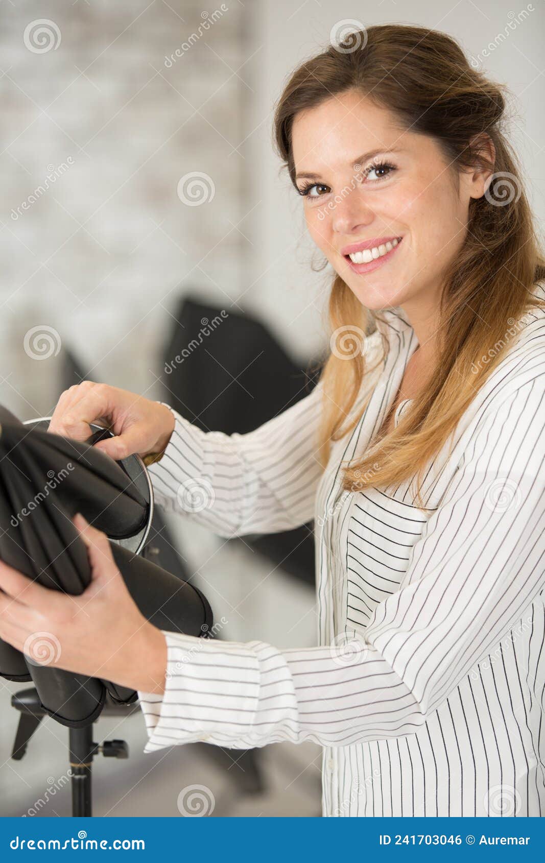 Woman setting up tripod stock photo. Image of creative - 241703046
