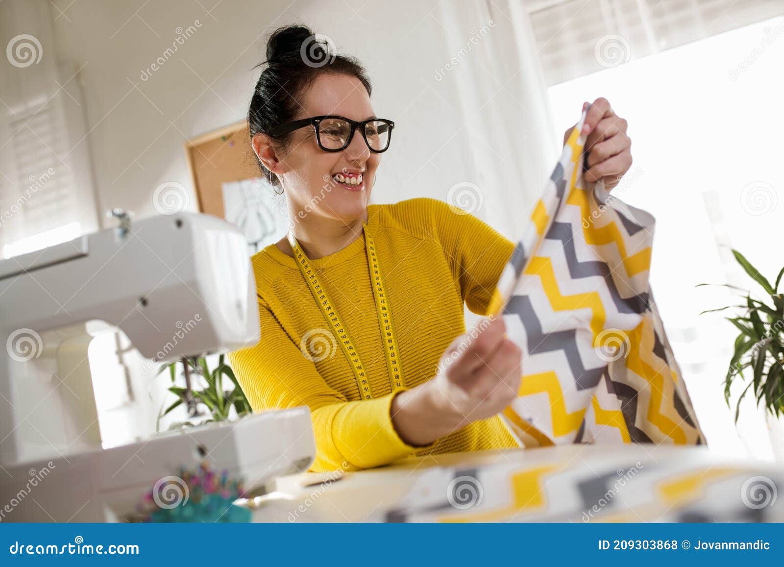 Woman Sewing on a Sewing Machine at Her Home Stock Photo - Image of ...