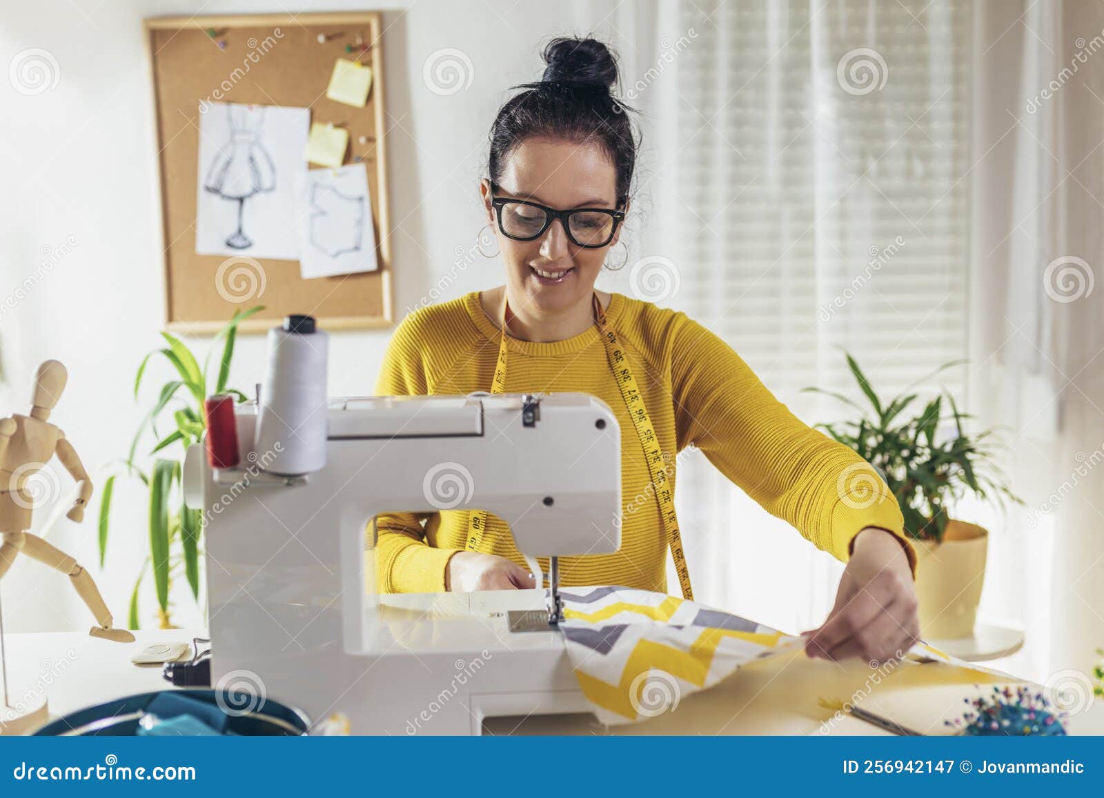 Woman Sewing on a Sewing Machine at Her Home. Stock Image - Image of ...