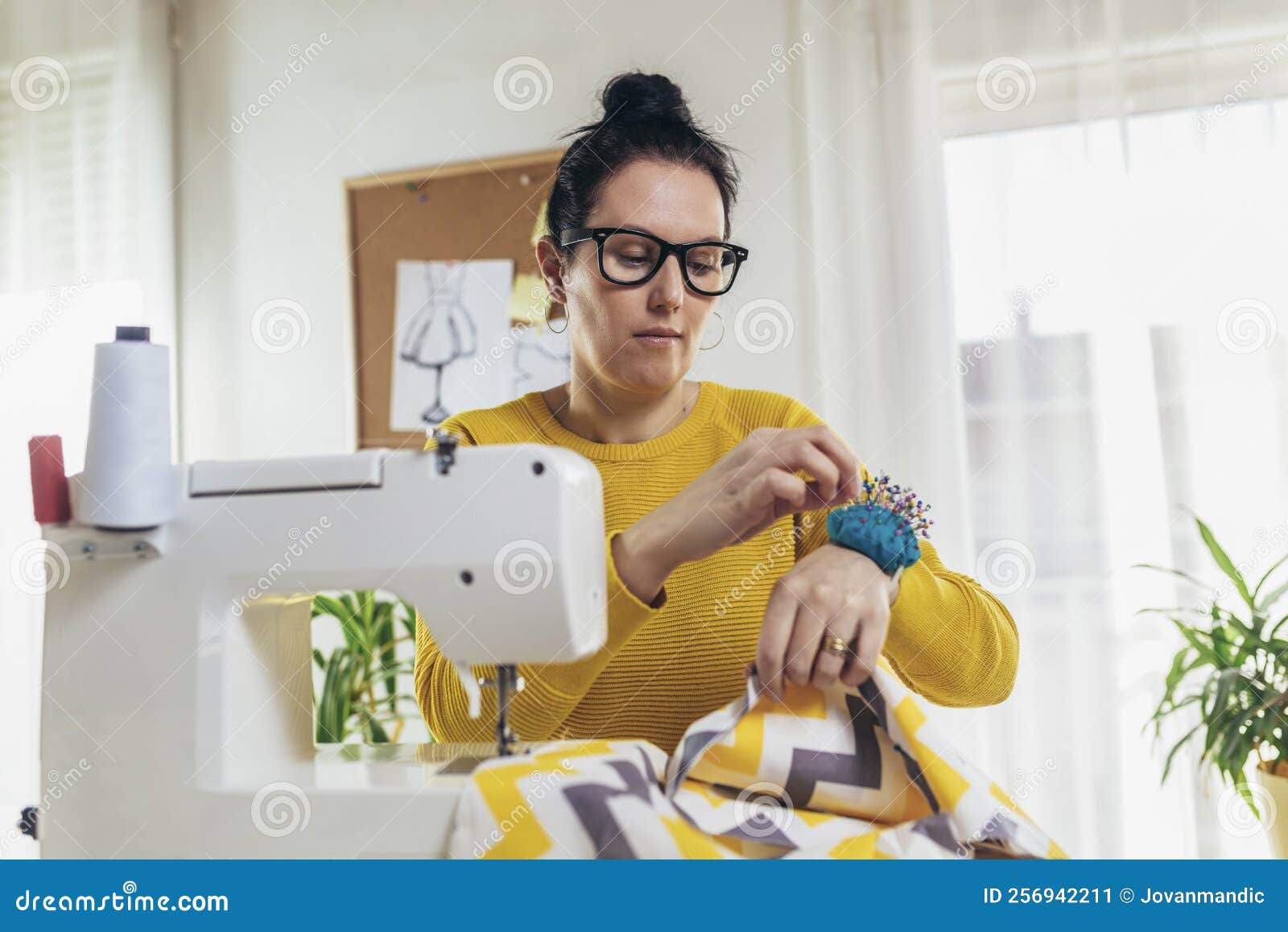Woman Sewing on a Sewing Machine at Her Home. Stock Image - Image of ...