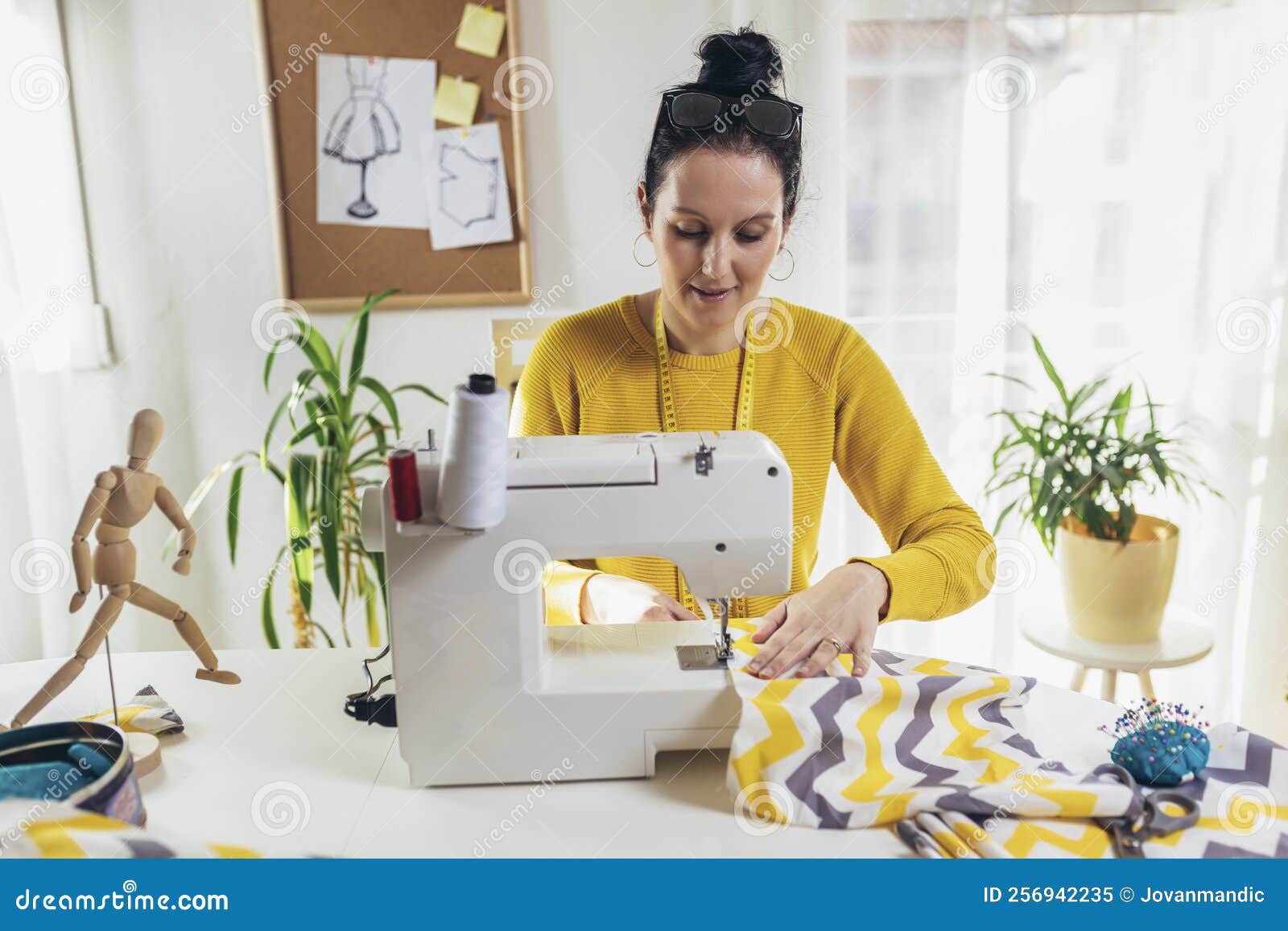 Woman Sewing on a Sewing Machine at Her Home. Stock Image - Image of ...
