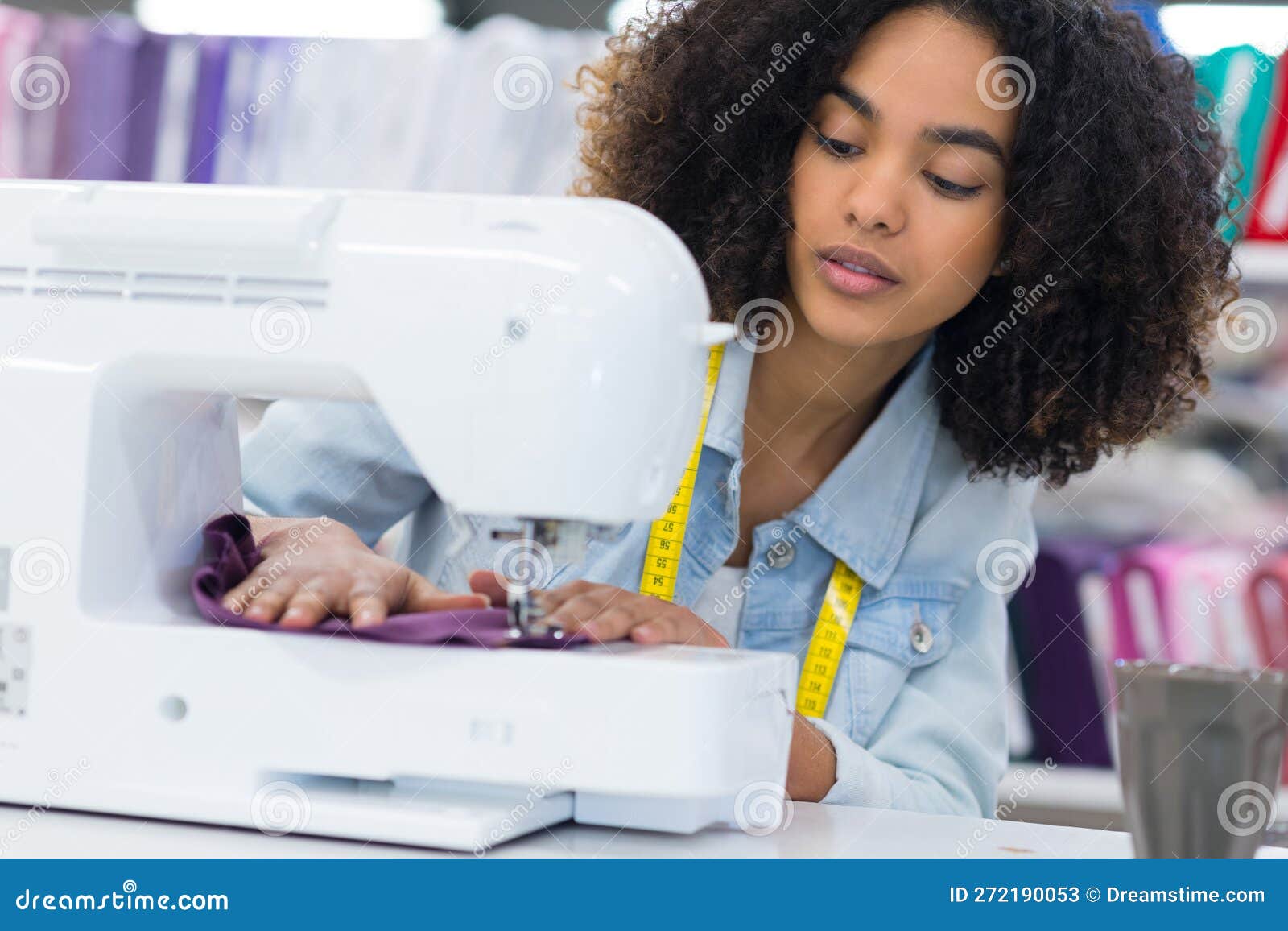 Woman on sewing machine stock image. Image of housework - 272190053