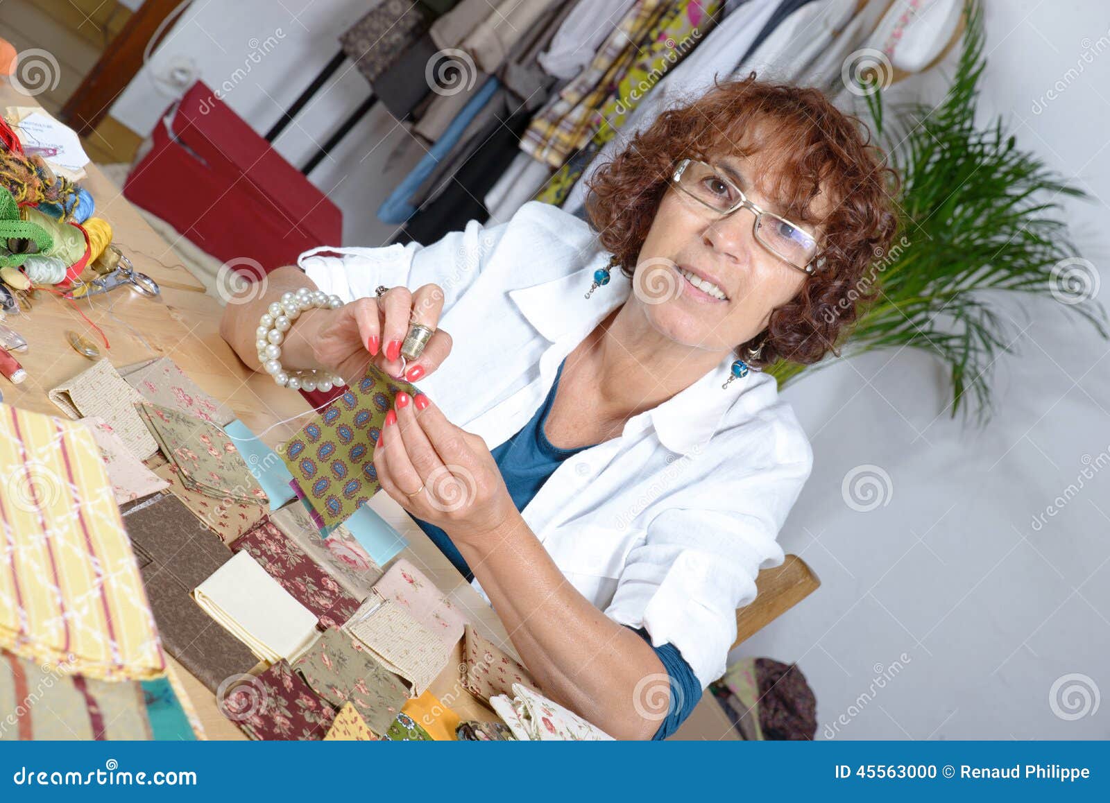 A woman sewing a patchwork stock photo. Image of quilt - 45563000