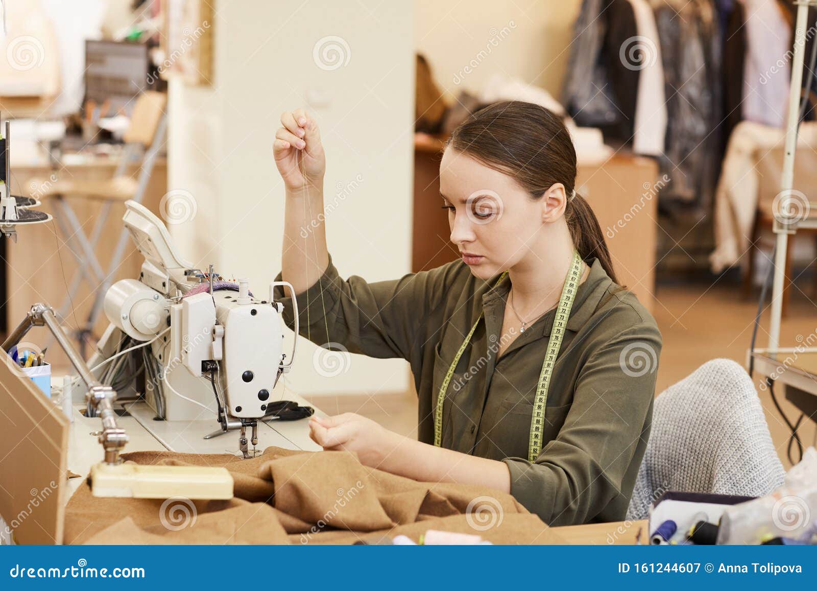 Woman sewing at the table stock image. Image of manufacturing - 161244607