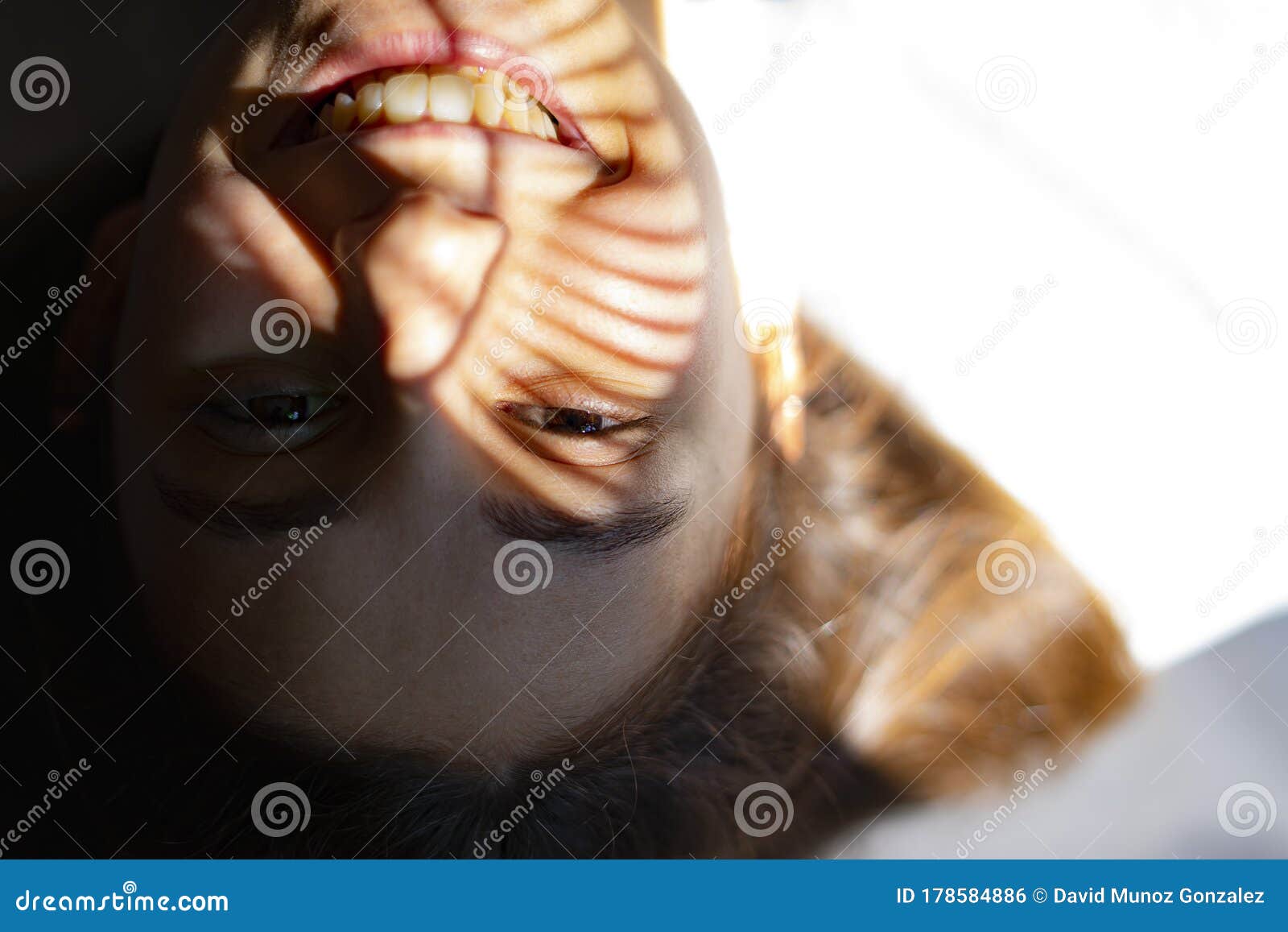 Woman with Shadows and Sunlight on Her Face Stock Photo - Image of ...