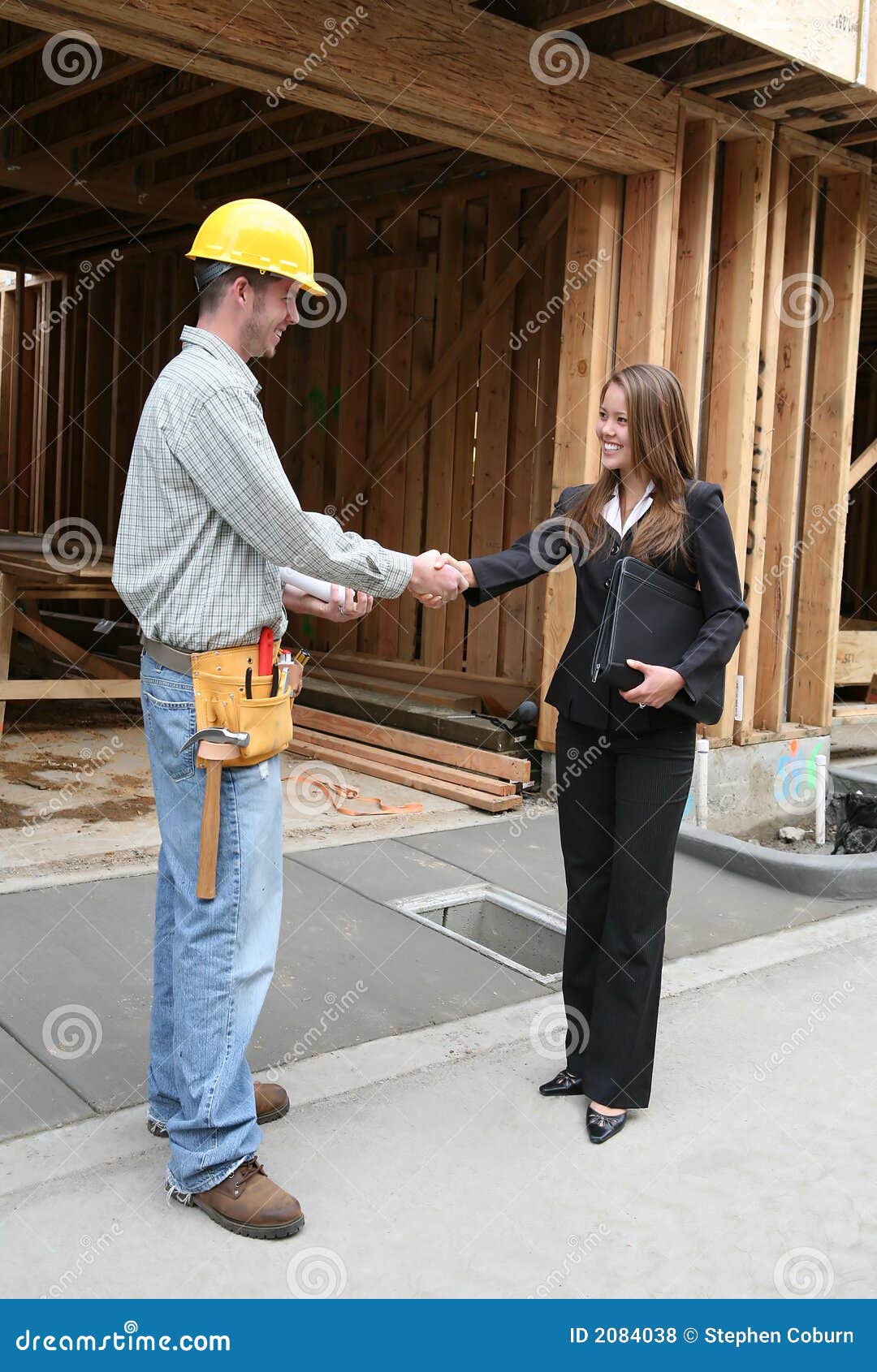 Woman Shaking Hands with Construction Man Stock Photo - Image of ...