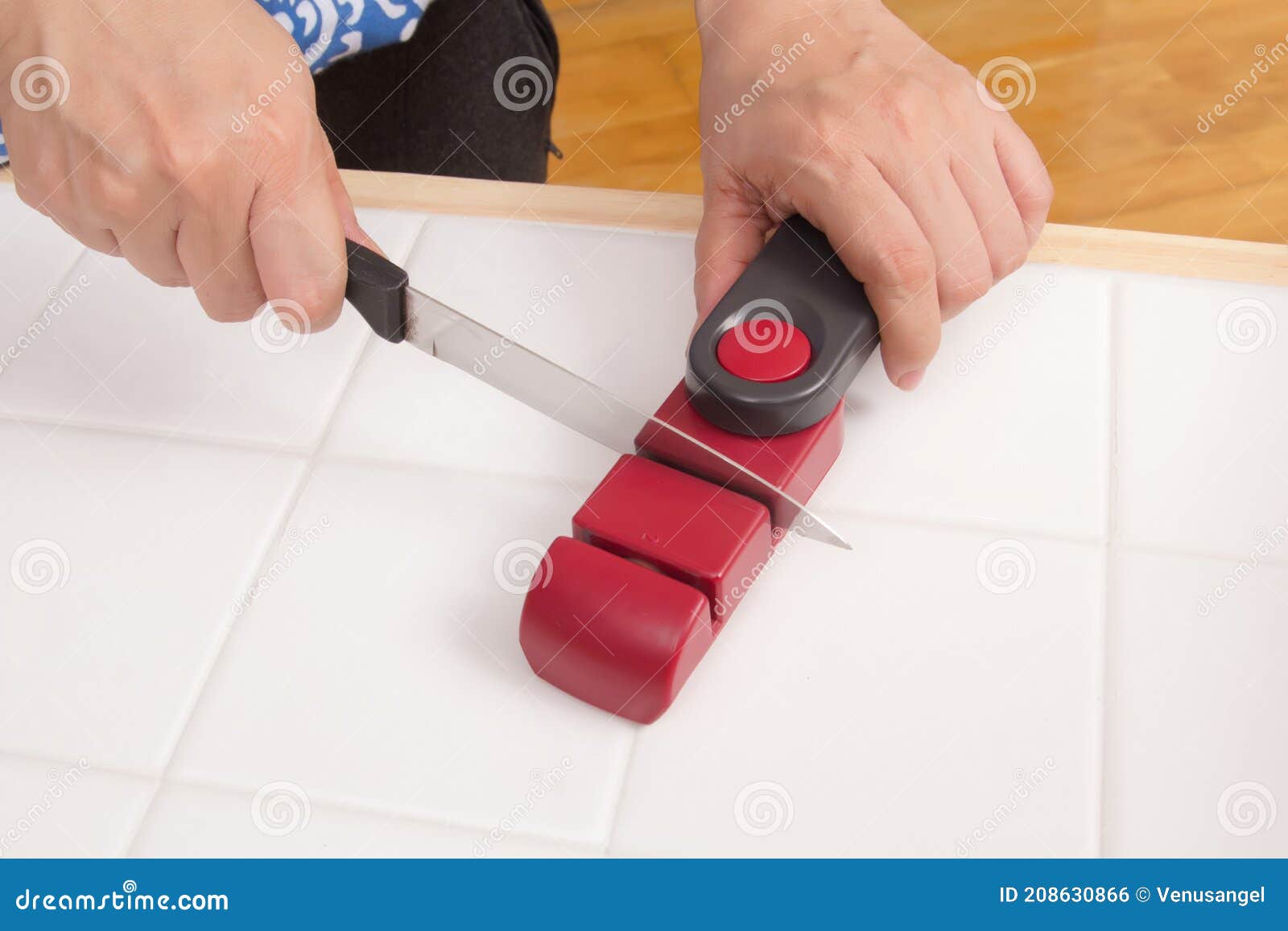 Woman Sharpening a Knife with Sharpener Stock Photo - Image of tool ...