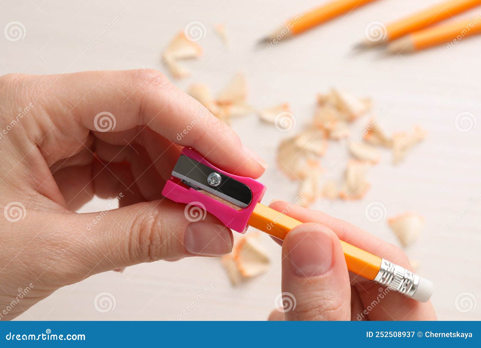 Woman Sharpening Pencil at Light Table, Closeup Stock Image - Image of ...