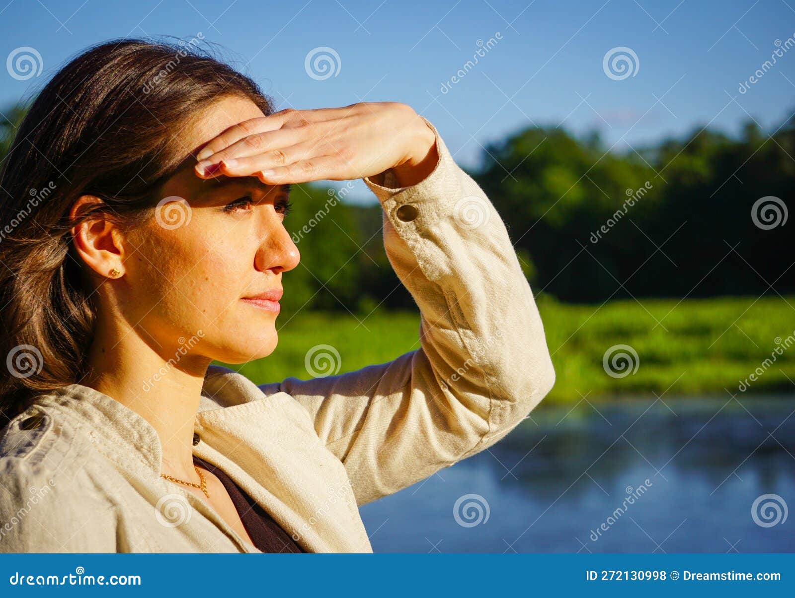 Woman Shielding Eyes while Standing by Lake Stock Photo - Image of ...